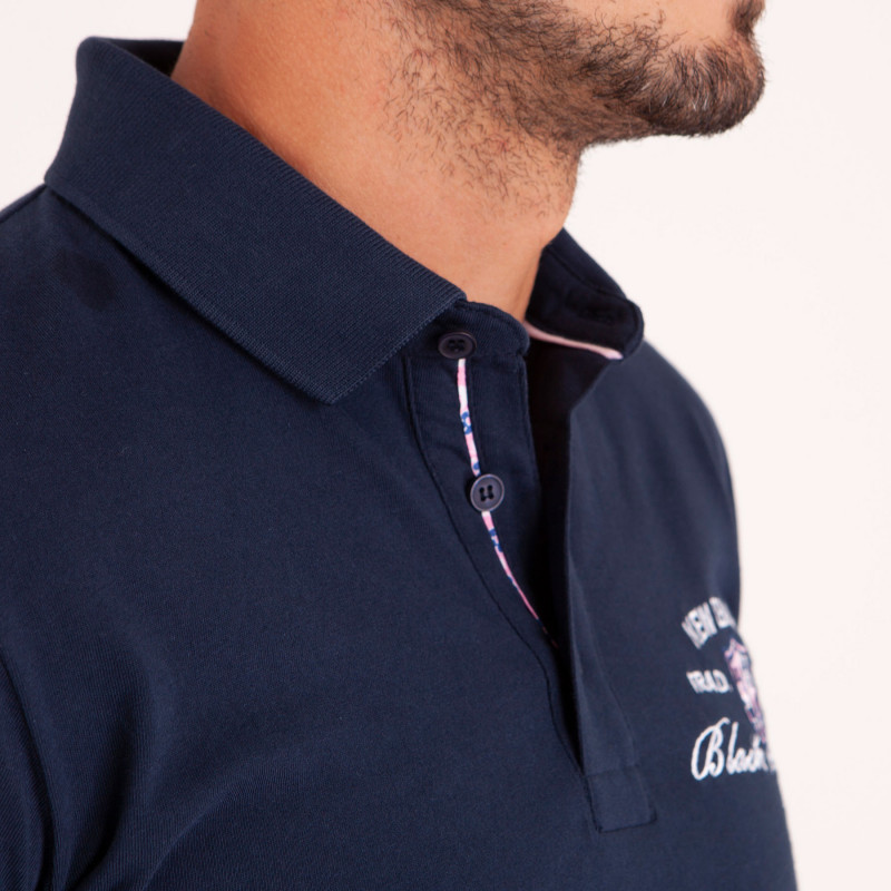 Polo uni détails col et manche droite tricolore
